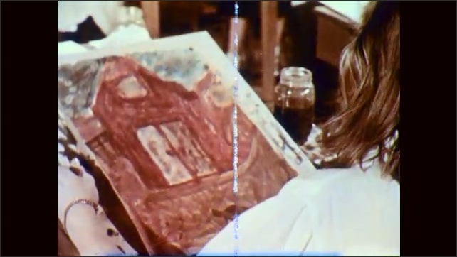 1950s: Art student walks from front of classroom to desk, dejected ...