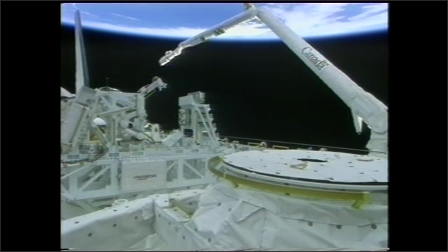 1990s: Animation. Astronauts on Mars. Space shuttle in orbit. Earth’s ...