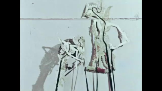 Indonesia 1950s: Wayang shadow puppets move across the screen. Javanese ...
