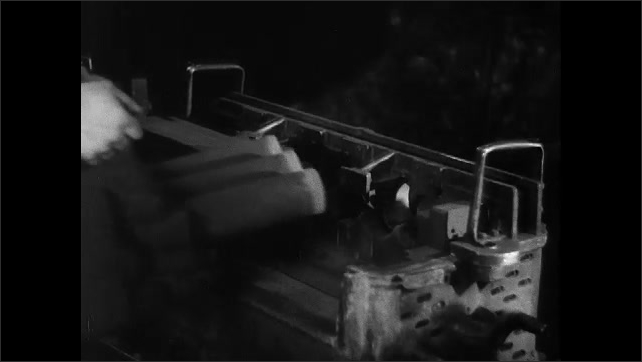 1930s: Men place lid on tray, flip tray over, remove bottom, reveal ...