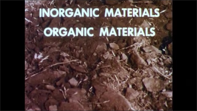 1960s: Text appears on overturned soil. – Archival Footage