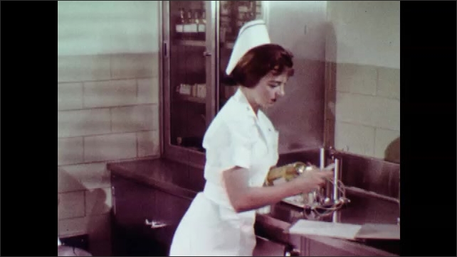 1970s: UNITED STATES: nurse takes chart from cabinet. Nurse speaks on ...