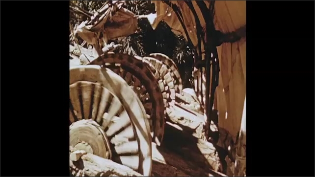 1950s: Ropes attached to pulleys pull up water in catches from well ...