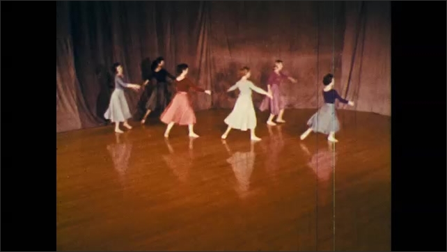 1960s: group of dancers performing slow, graceful turns and other ...