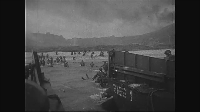 1940s: Normandy, Europe: landing barges arrive at beach. Concrete ...