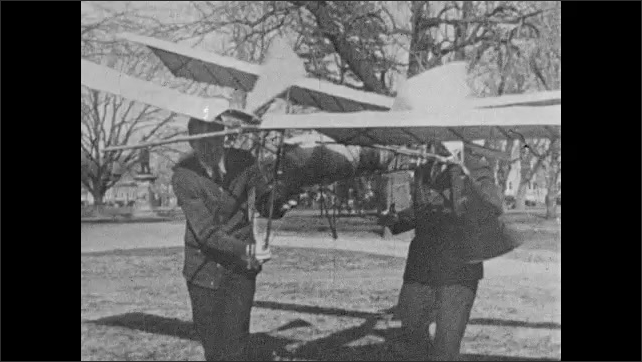 1930s: UNITED STATES: close up of propellers on early model of plane ...