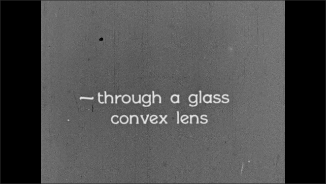 1930s: Title card. Light beams shine onto tank of water. Title card ...