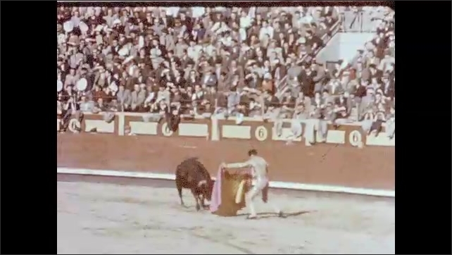 1950s: Matador speaks with fans. Matador fights bull in ring. Plane in ...