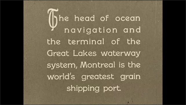 1920s: CANADA: MONTREAL: ship in harbour. Men load cargo onto boat ...