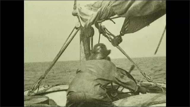 1930s: Title screen. Sail boat races through water. Sailor turns wheel ...