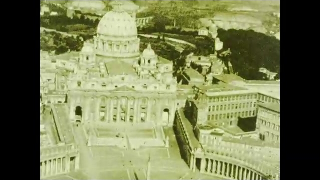 1930s: Words on page in book. St. Peter’s cathedral in Rome. People ...
