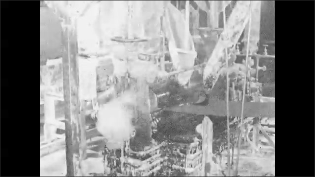 1930s: Steam and vapor rises out of ovens and off machinery rolling and ...