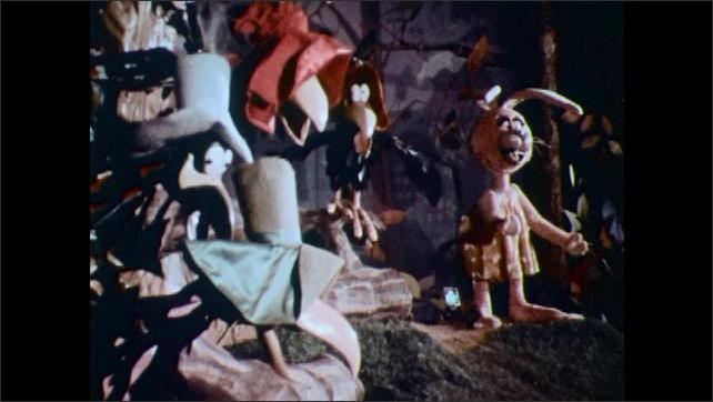 Animatronic crows in hats sway and open mouths. Animatronic rabbit ...