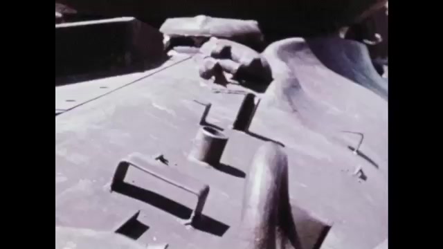 1960s: Balls roll over tank. Balls roll into hole on top of tank ...