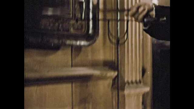 1950s: Person fixes bayonet to end of rifle and leans rifle against ...