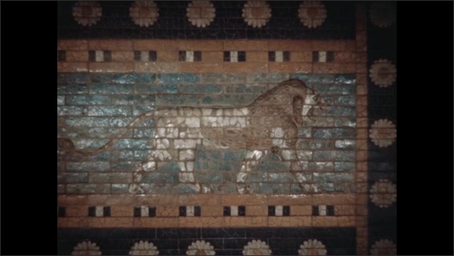 1940s: Sculpture of sphinx carved into stone. Tile painting of lion ...