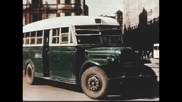 1960s: Buses dropping off passengers. People and cars travelling in the ...
