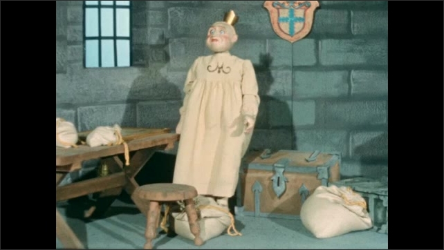 1940s: Hand holds shooting slate. Shadow. Puppet king in castle vault ...