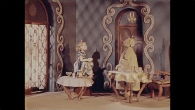 1970s: Flock of swan swim in pond. Marionettes move around medieval ...