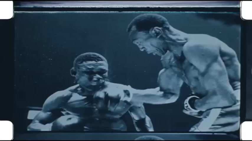 1970s: Still photos of boxing fights. Tilt up photo of injured boxer ...