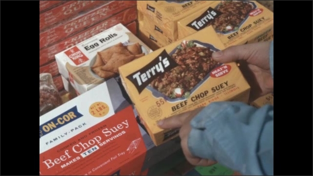 1960s: Boy points at frozen beef chop suey in freezer case at grocery ...
