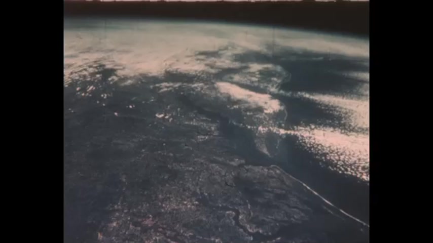 1950s: View of Earth from space. Water flowing past a rock. Views of ...