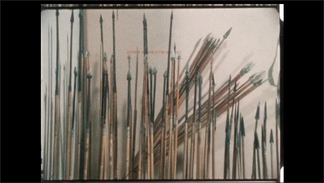 1970s: Bows and arrows in display case of museum. – Archival Footage