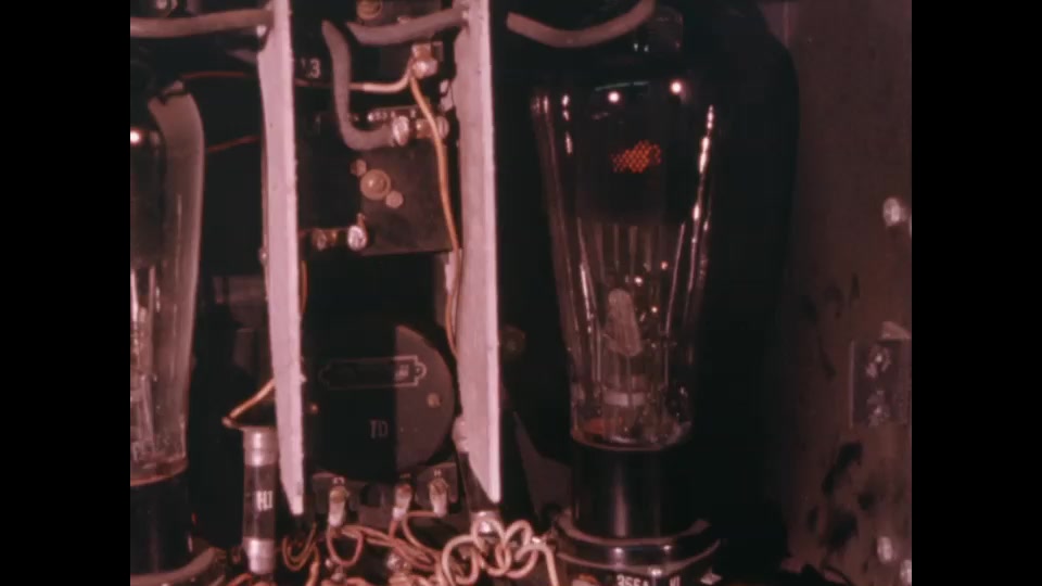 1960s: Two lightbulbs, tubes and wires with a meter attached ...
