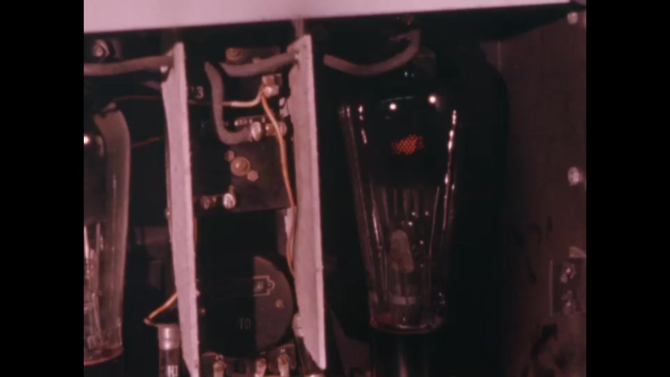 1960s: Two lightbulbs, tubes and wires with a meter attached ...
