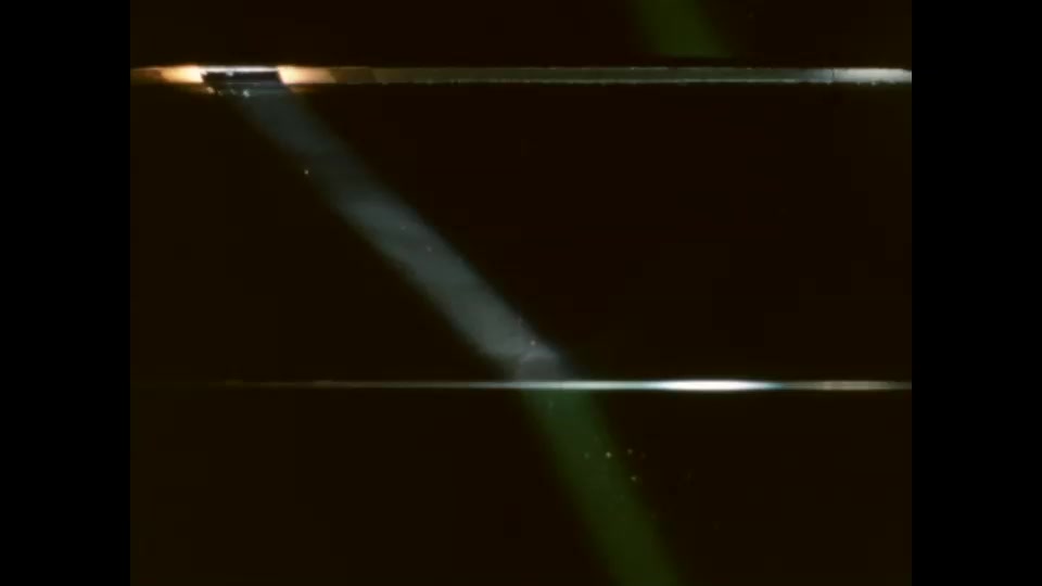 1960s: Water refracting a bright beam of light. – Archival Footage