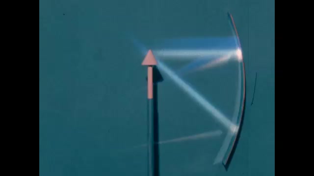 1950s: Metal cones and curved piece of metal. Light rays shining off of ...