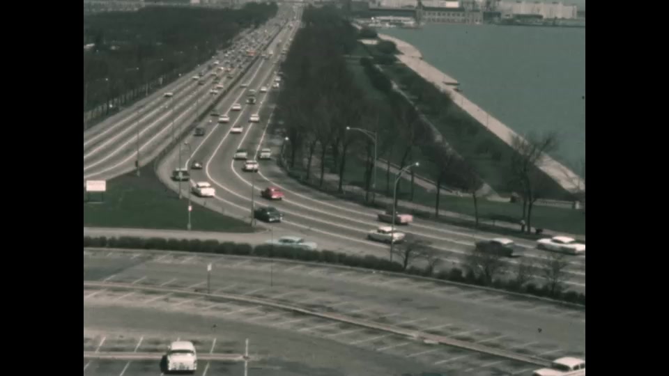 1960s: Highway traffic with city skyline in background. – Archival Footage