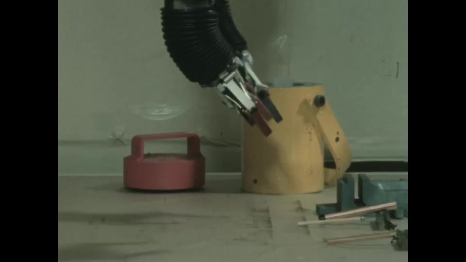 1960s: Robotic arms pick up objects. Arms put knife together and take ...