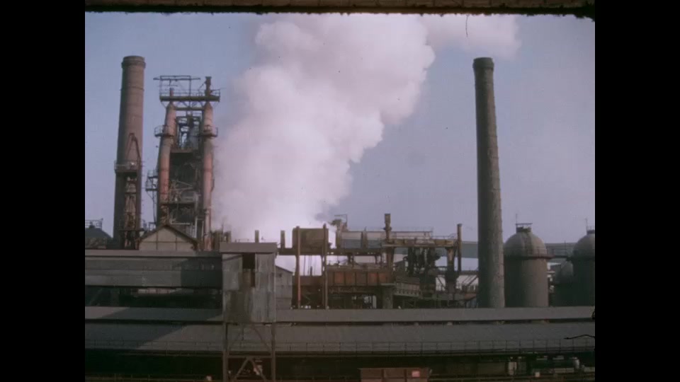 1960s: Smoke billows from power plant. – Archival Footage