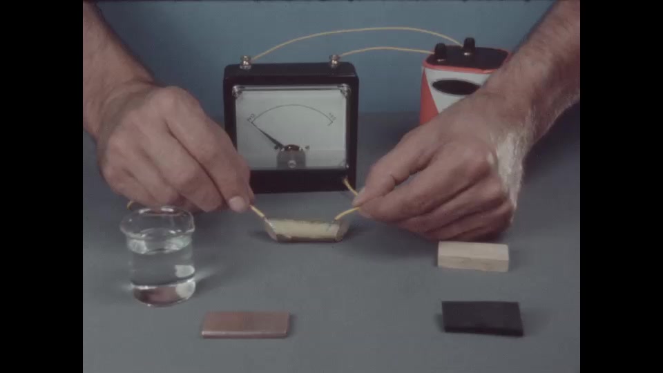 1960s: Wires touched to tree branch, wire touched against other ...