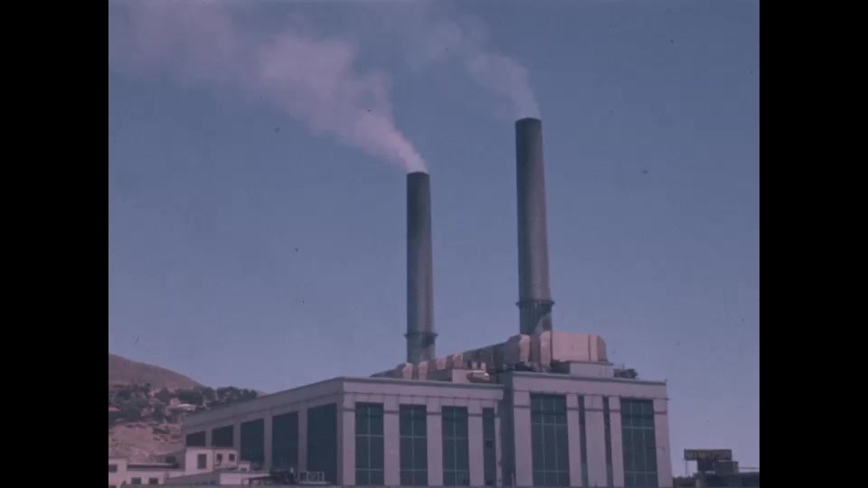 1960s: Exterior of large factory. – Archival Footage
