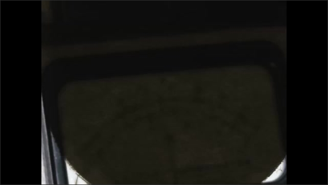 1960s: Tip of tele-thermometer rests underneath rainbow of light ...