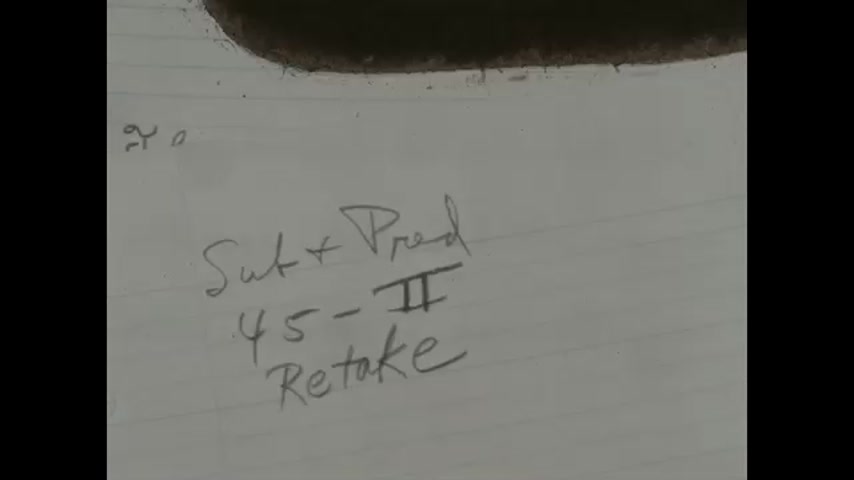 1960s: Text on notebook paper. Hand holding pencil, circling ...