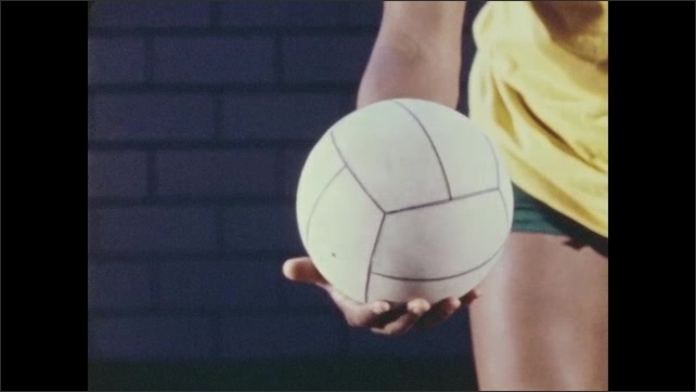 1970s: Volleyball player serves ball on court, two teams play game ...
