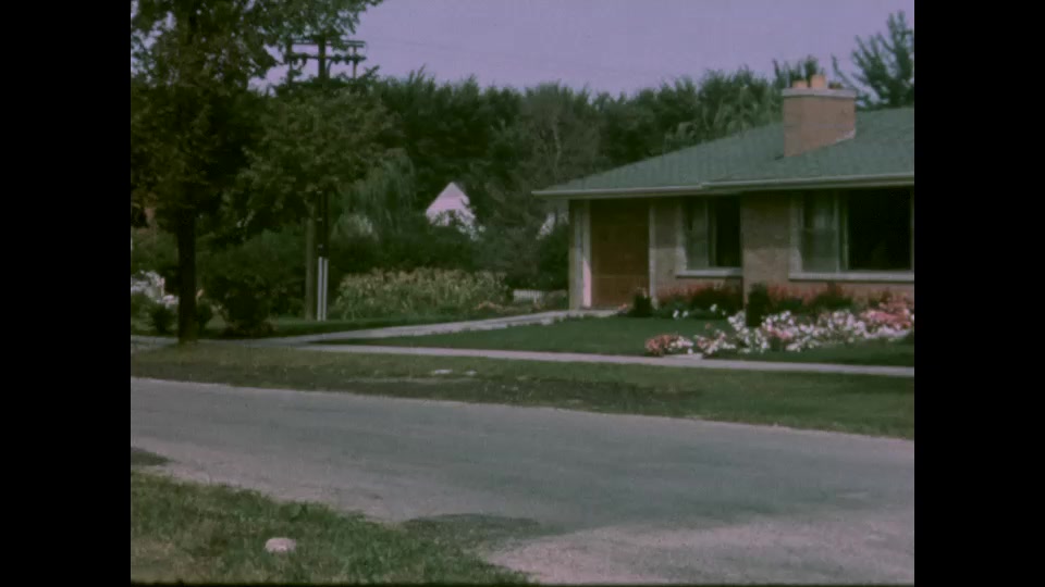 1950s: School bus stops in neighborhood. Brother, sister, girl, and ...