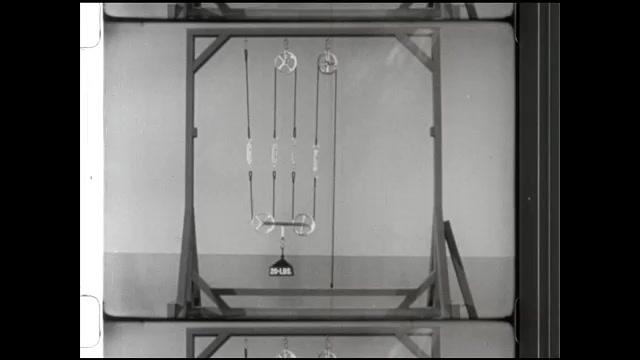 1950s: Five ropes move through three movable pulleys in lab. – Archival ...