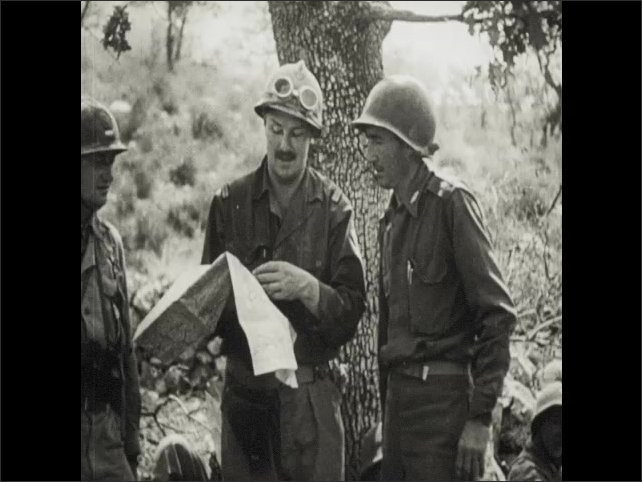 1940s: Soldiers in conversation. Soldiers prep for battle. Cannons on ...