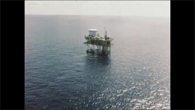 1960s: UNITED STATES: view of offshore rig from helicopter. Rig in Gulf ...