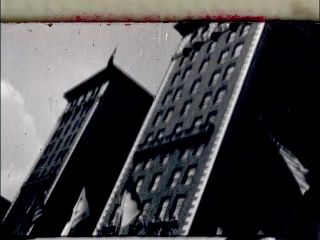 1950s: Rows of matching buildings followed by aerial view of city ...