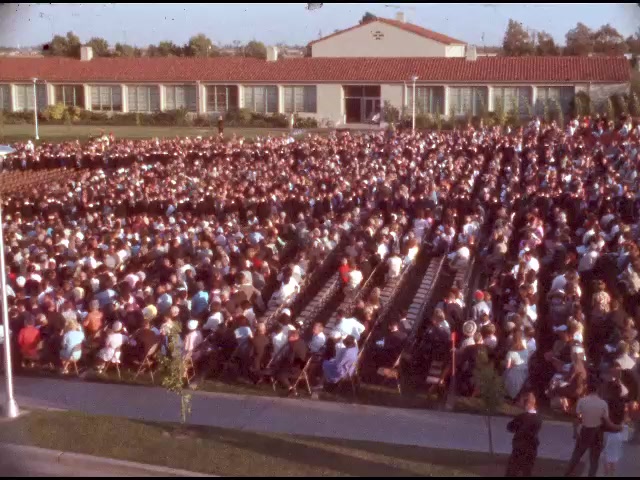 1950s: UNITED STATES: people attend graduation ceremony. Students in ...