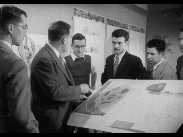 1950s: Men gather around drafting table, look at designs. Nassau Hall ...