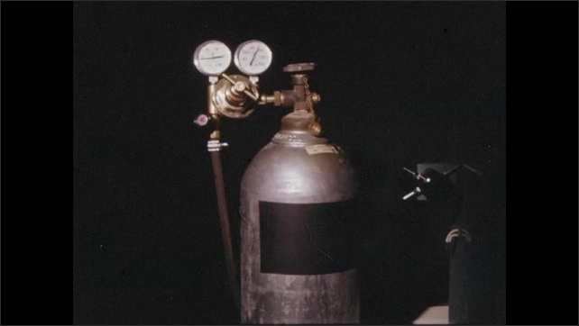 1960s: Gauges on a metal Helium tank. Needles on gauges. – Archival Footage