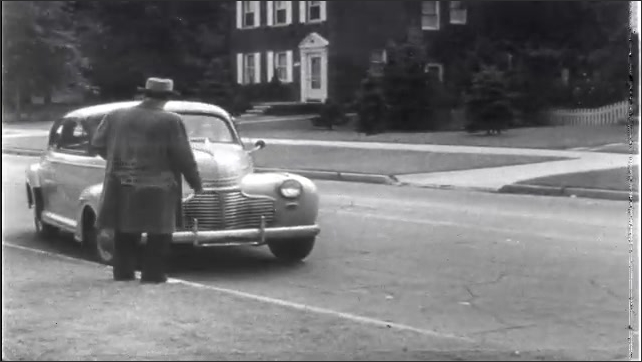 1940s: UNITED STATES: Volkswagen cars. Tanks and guns. Chevrolet car ...