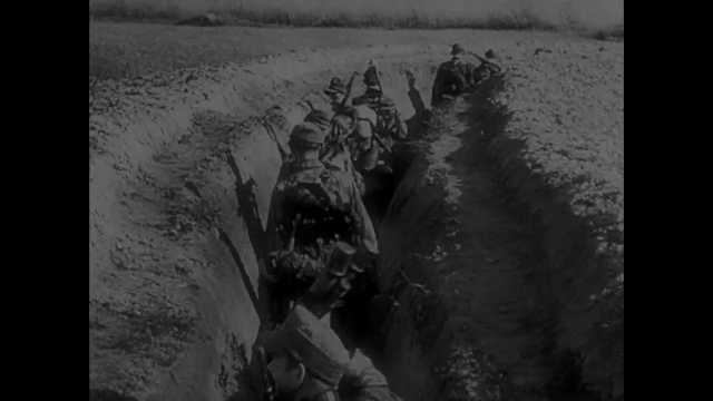 1940s: Soldiers carry guns and supplies through trenches. Soldiers set ...