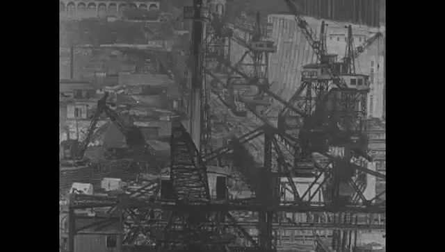1910s: Large, industrial construction site. People at work constructing ...